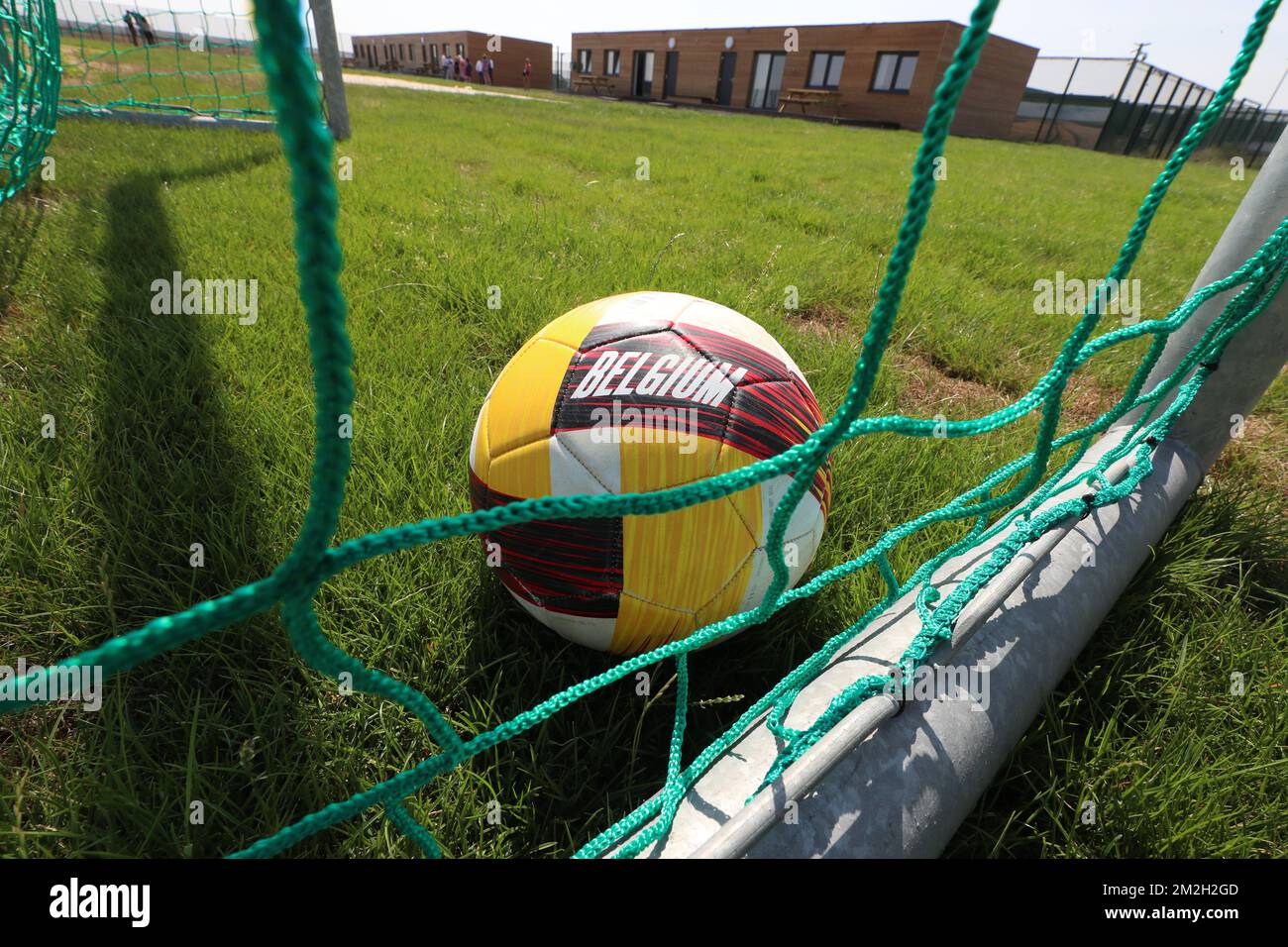 Illustration shows a ball with 'Belgium' on it, in a soccer goal at a ...