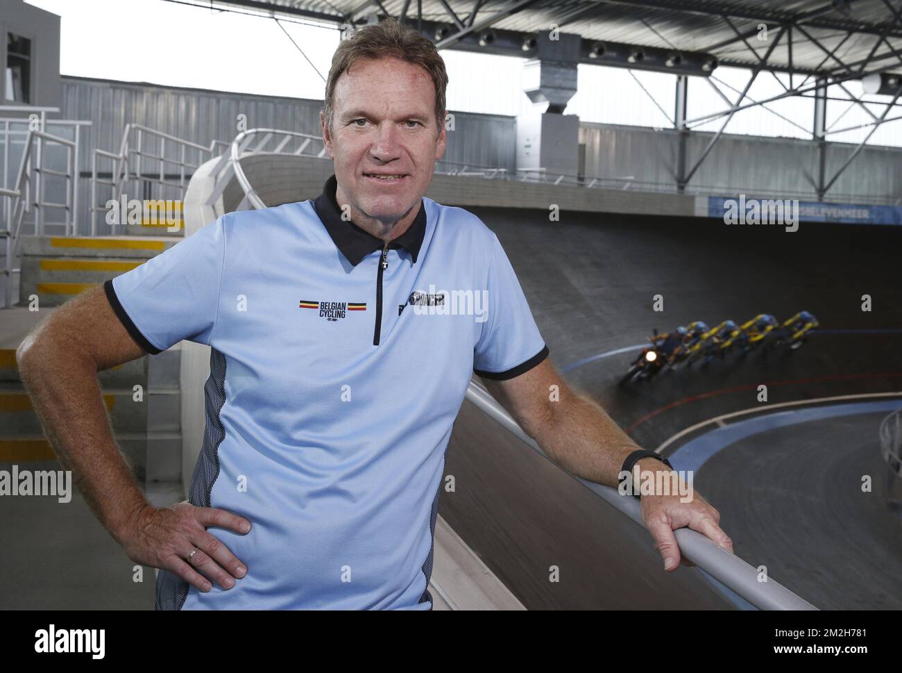 Coach Peter Pieters poses for the photographer during a press ...