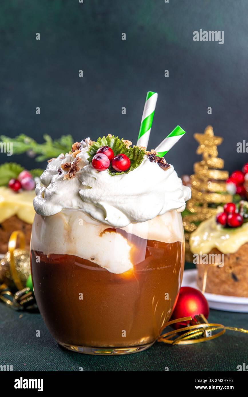 Christmas pudding latte. Sweet coffee drink with whipped cream, vanilla ...