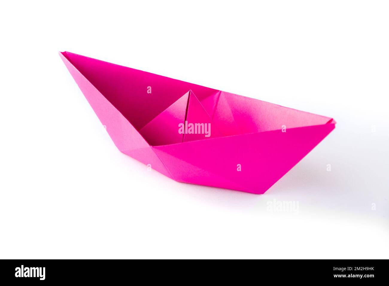 Pink paper boat origami isolated on a blank white background Stock ...