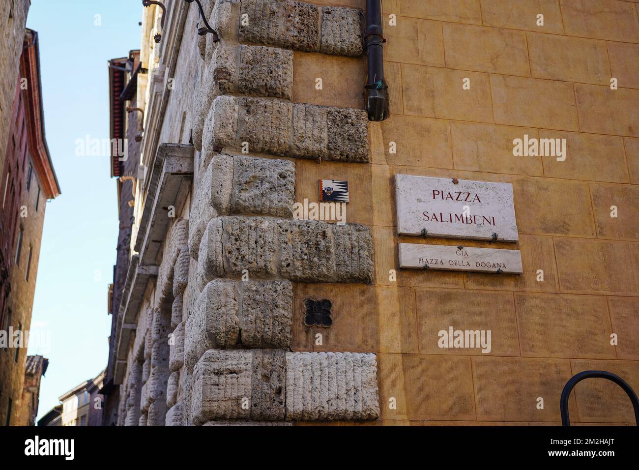 Traditional marble street sign in the city of Siena, Italy Stock Photo ...