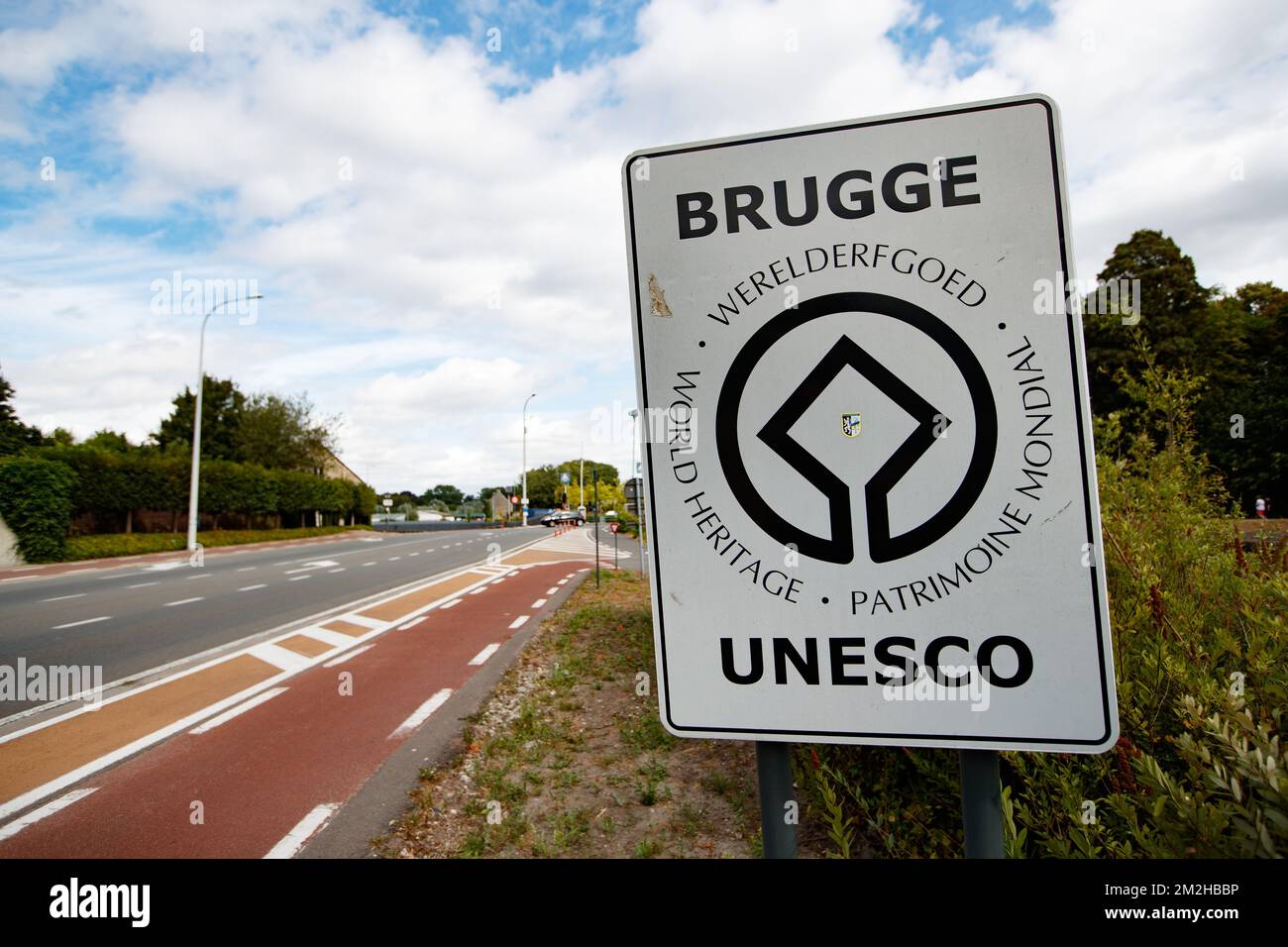 Illustration shows the name of the Brugge municipality on a road sign ...