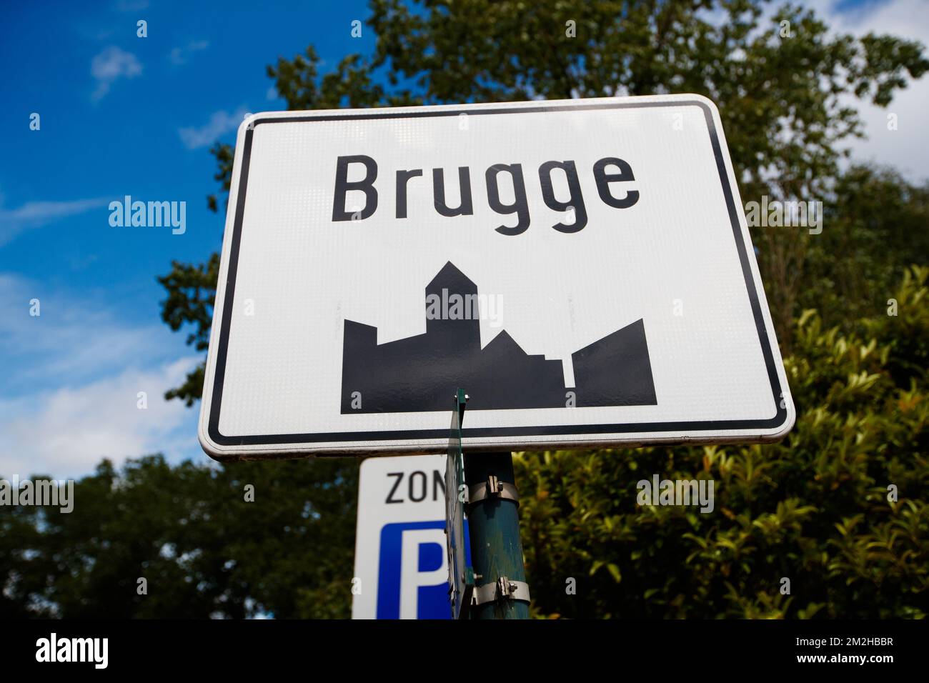 Illustration shows the name of the Brugge municipality on a road sign ...