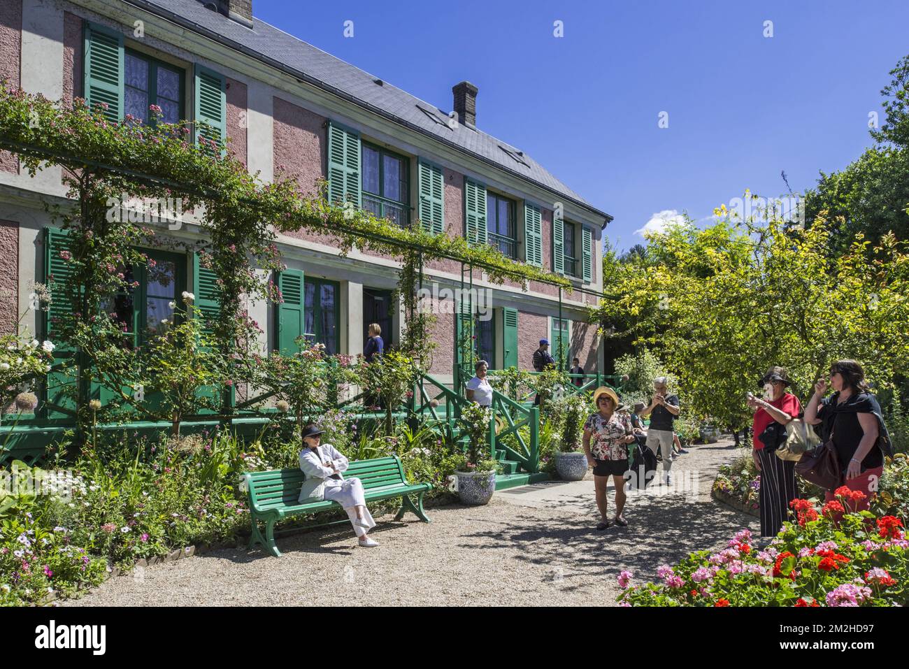 Tourists visiting the garden and house in summer of Impressionist ...