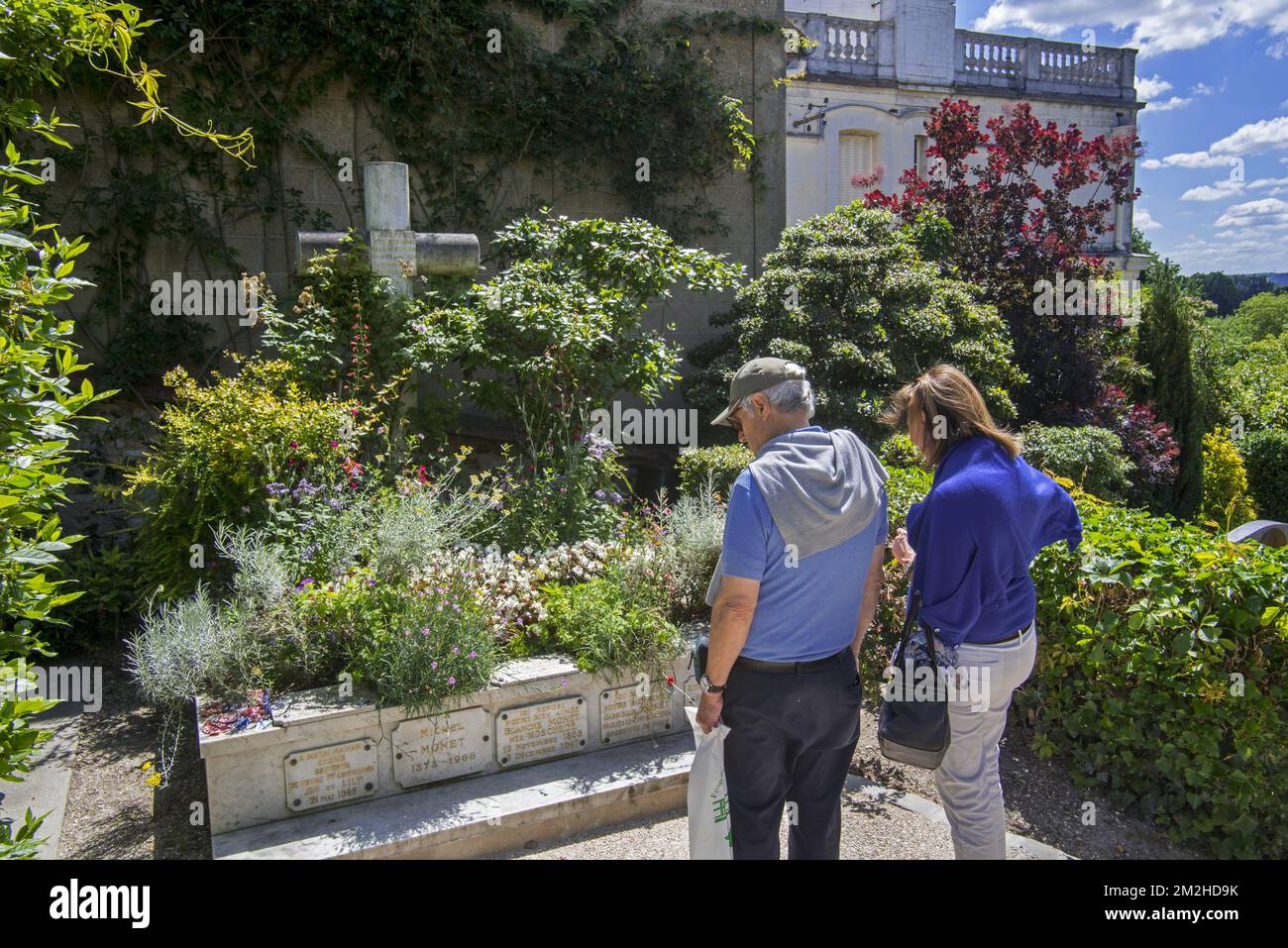 Tourists visiting the family grave of Impressionist painter Claude ...