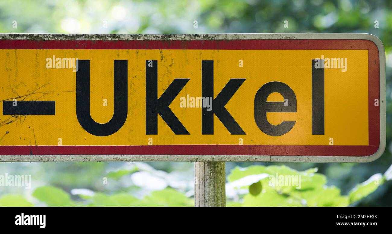 Illustration shows the name of the Uccle - Ukkel municipality on a road ...