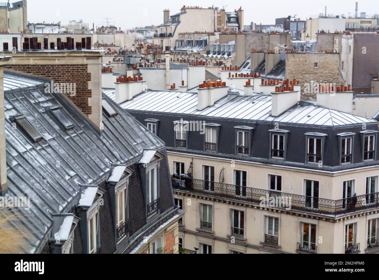 Rooftops of Parisian buildings under snow, Paris, IDF, France, Europe ...