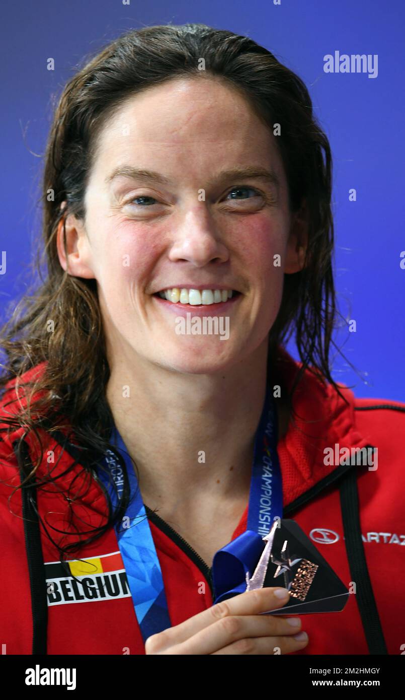 Belgian swimmer Kimberly Buys poses for the photographer with the brons ...