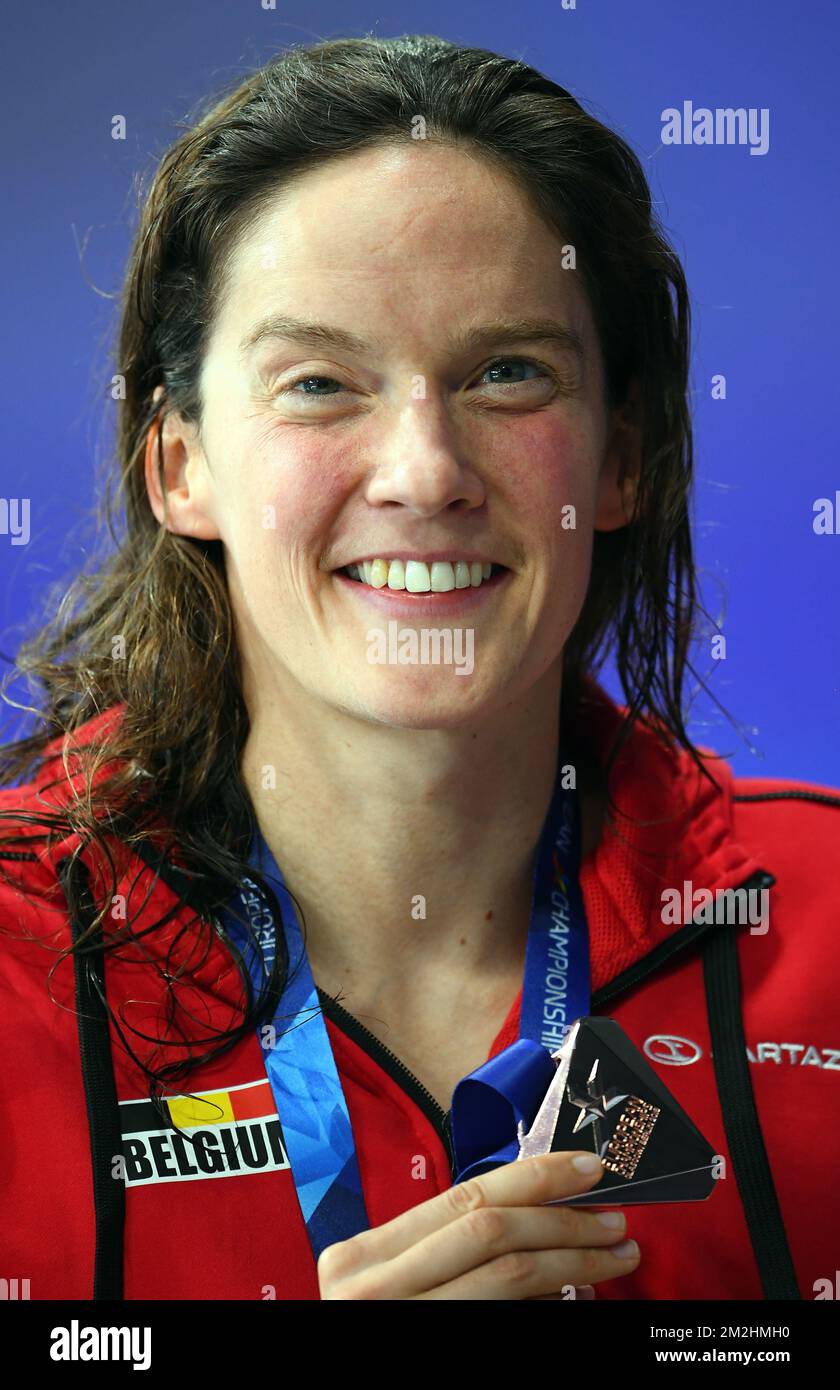 Belgian swimmer Kimberly Buys poses for the photographer with the brons ...