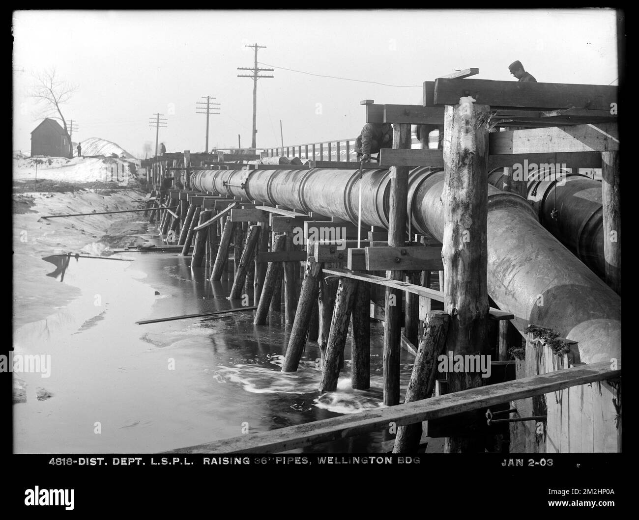 Distribution Department, Low Service Pipe Lines, raising 36-inch pipes ...