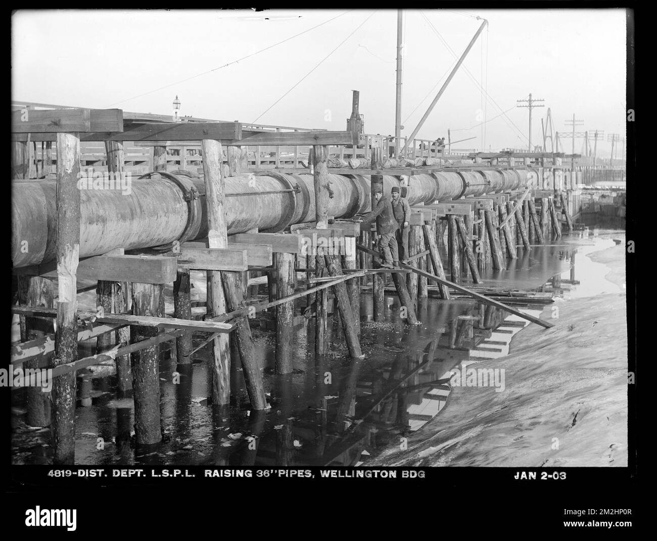 Distribution Department, Low Service Pipe Lines, raising 36-inch pipes ...