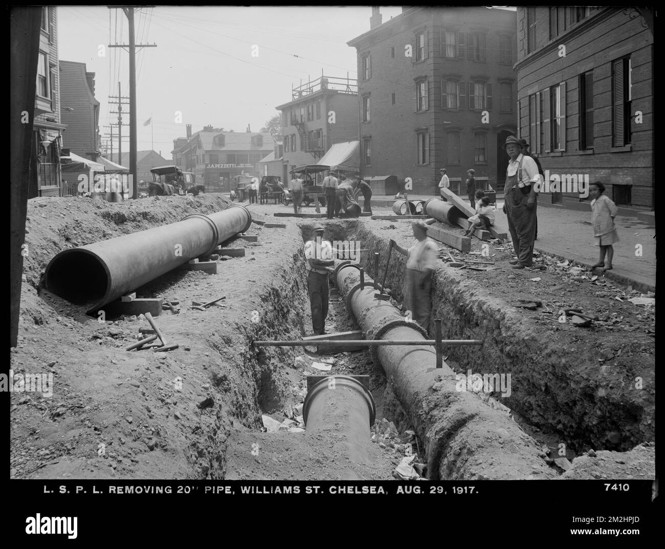 Distribution Department, Low Service Pipe Lines, removing 20-inch pipe ...