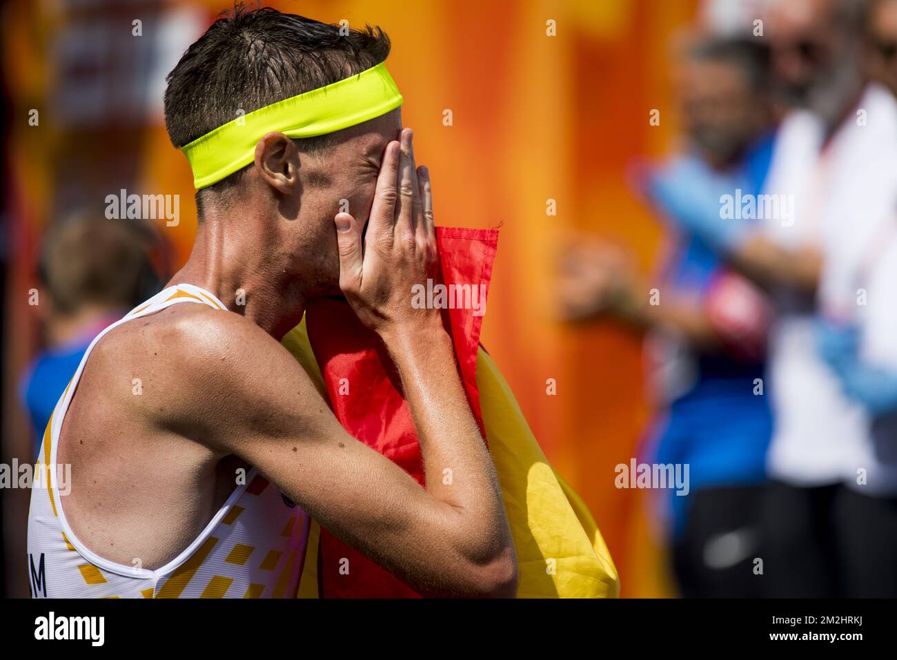 Belgian athlete Koen Naert celebrates as he crosses the finish line to ...