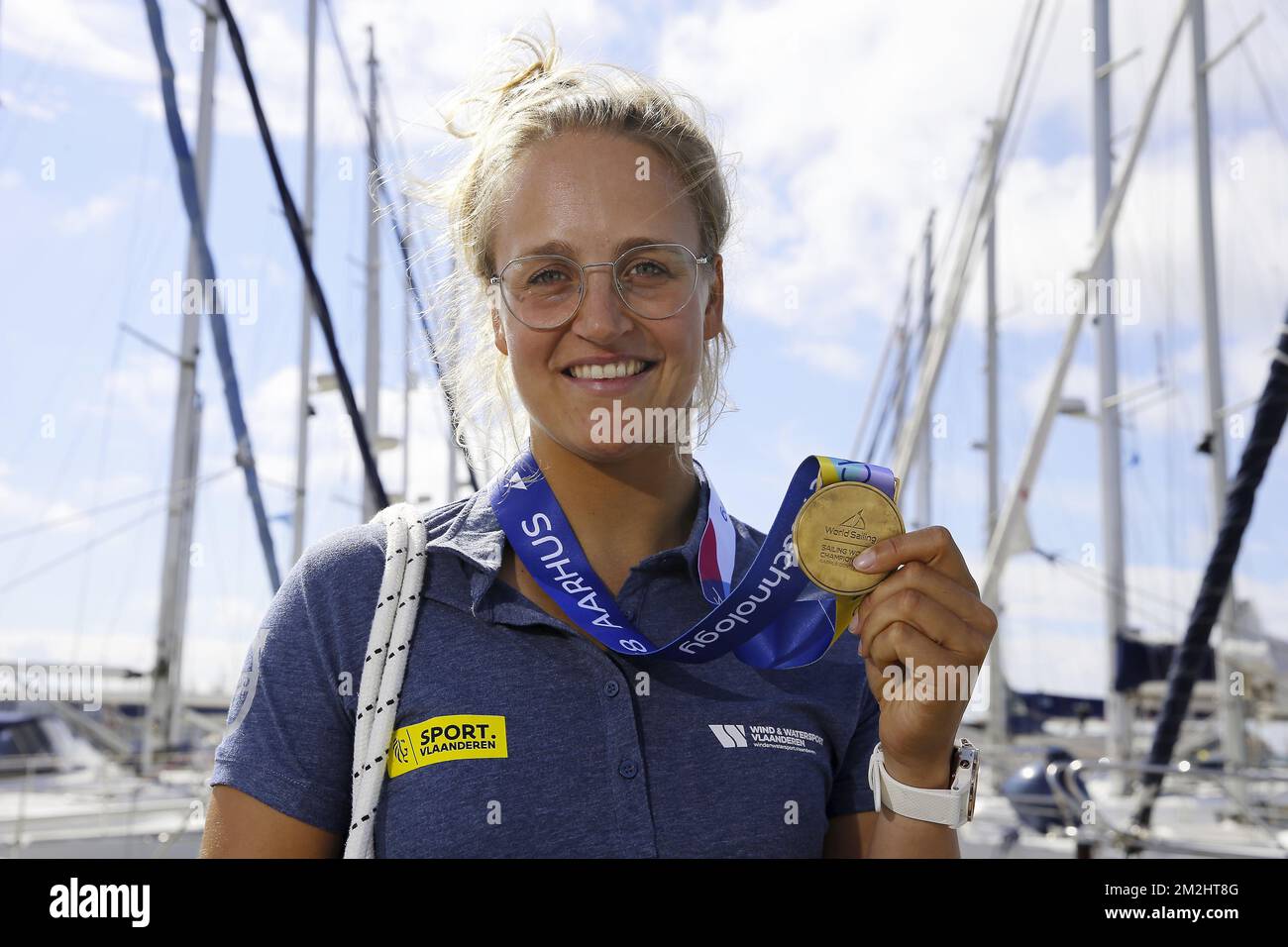 Belgian sailor Emma Plasschaert poses for the photographer with her ...