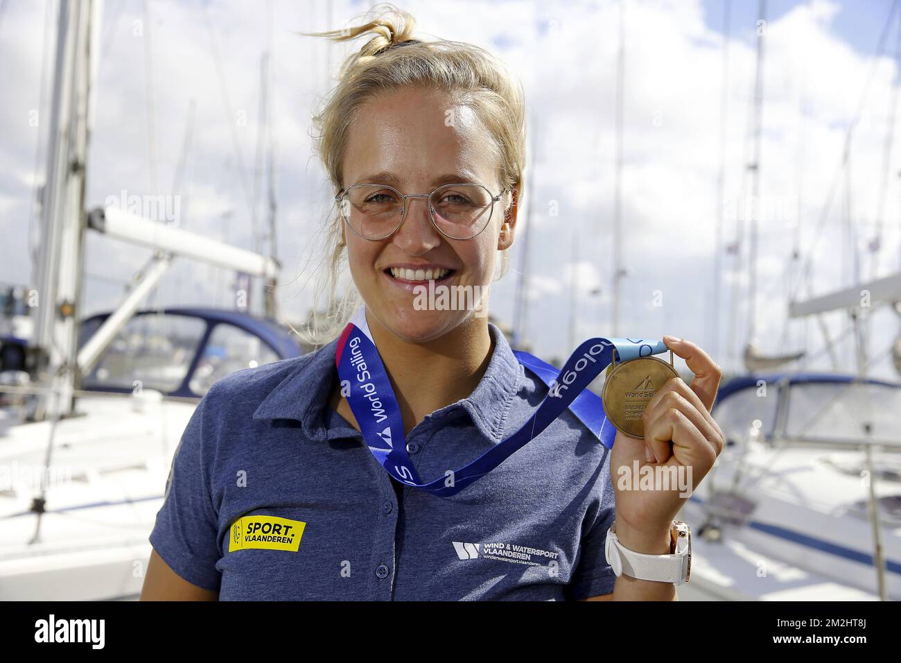 Belgian sailor Emma Plasschaert poses for the photographer with her ...