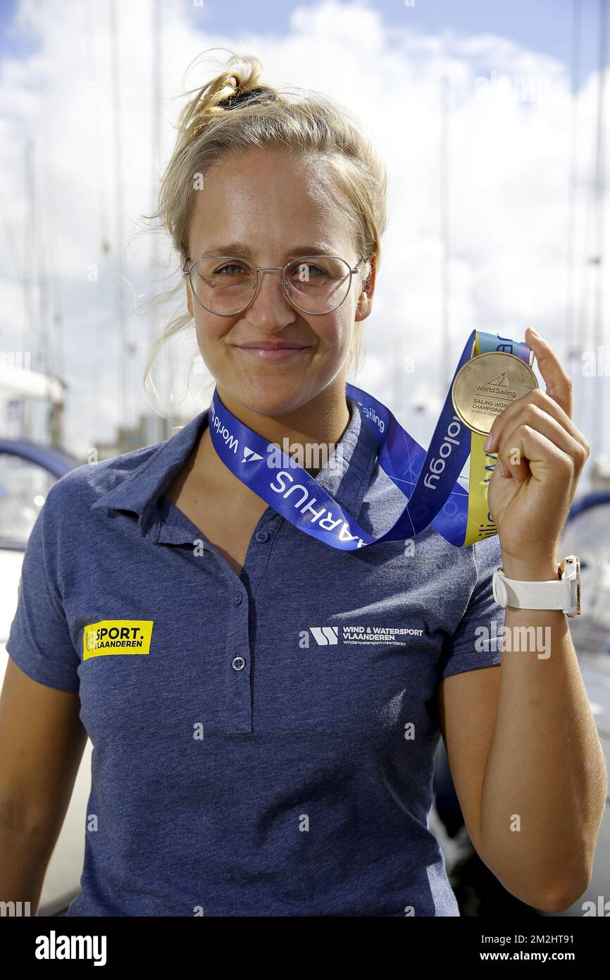 Belgian sailor Emma Plasschaert poses for the photographer with her ...