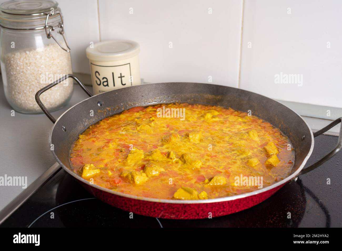 Pan for paellas with vegetables, ingredients and meat taking ...