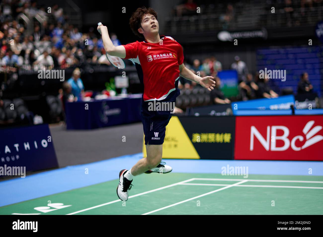 HE Ji Ting of China in action during the mens semi finals doubles match ...