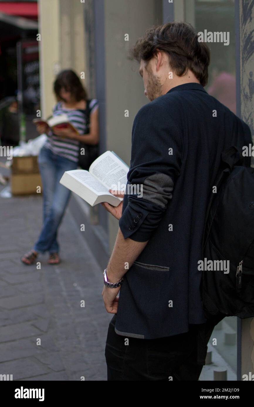 Couple standing on books hi-res stock photography and images - Alamy