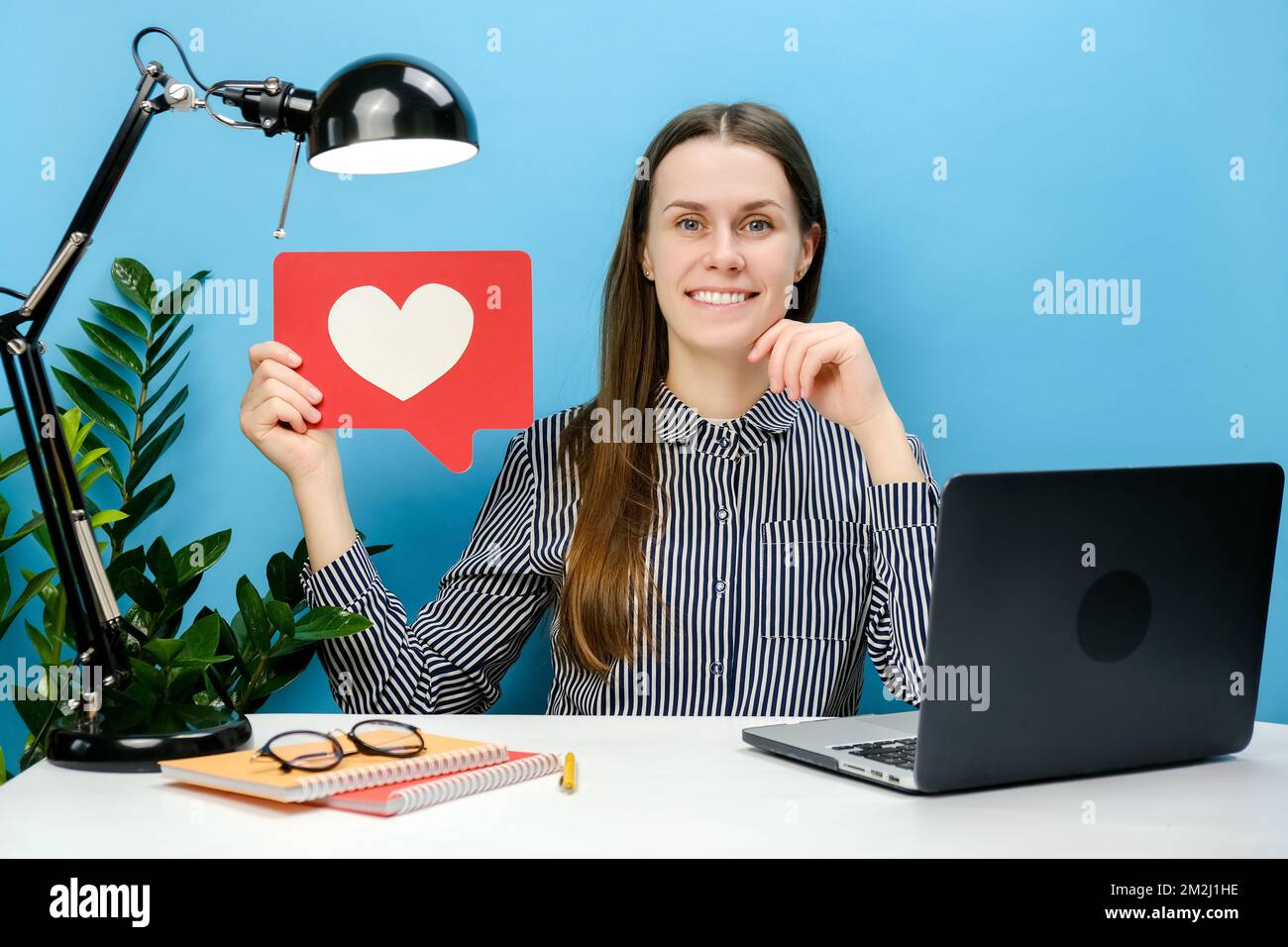 Happy employee young female holding like counter template sitting at ...