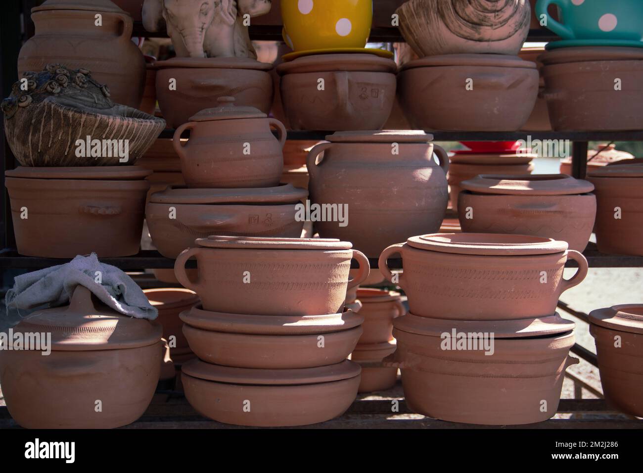 Pieces displayed in craft pottery shop Stock Photo - Alamy