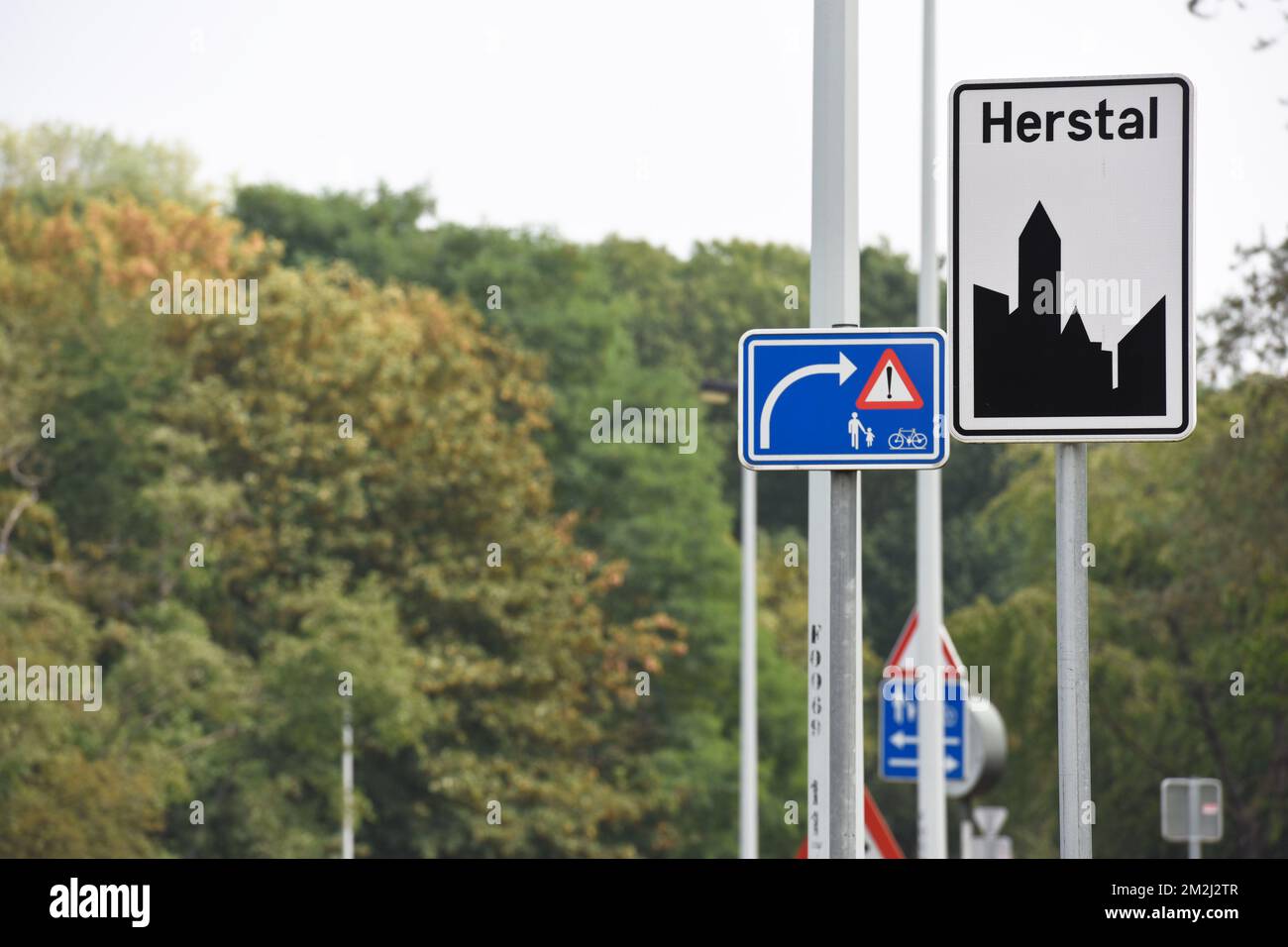 Illustration shows the name of the Herstal municipality on a road sign ...