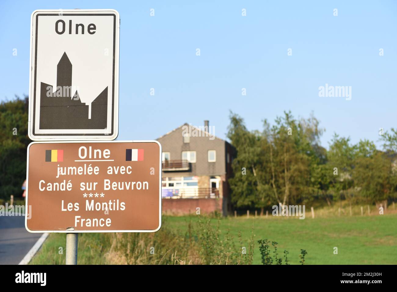 Illustration shows the name of the Olne municipality on a road sign ...