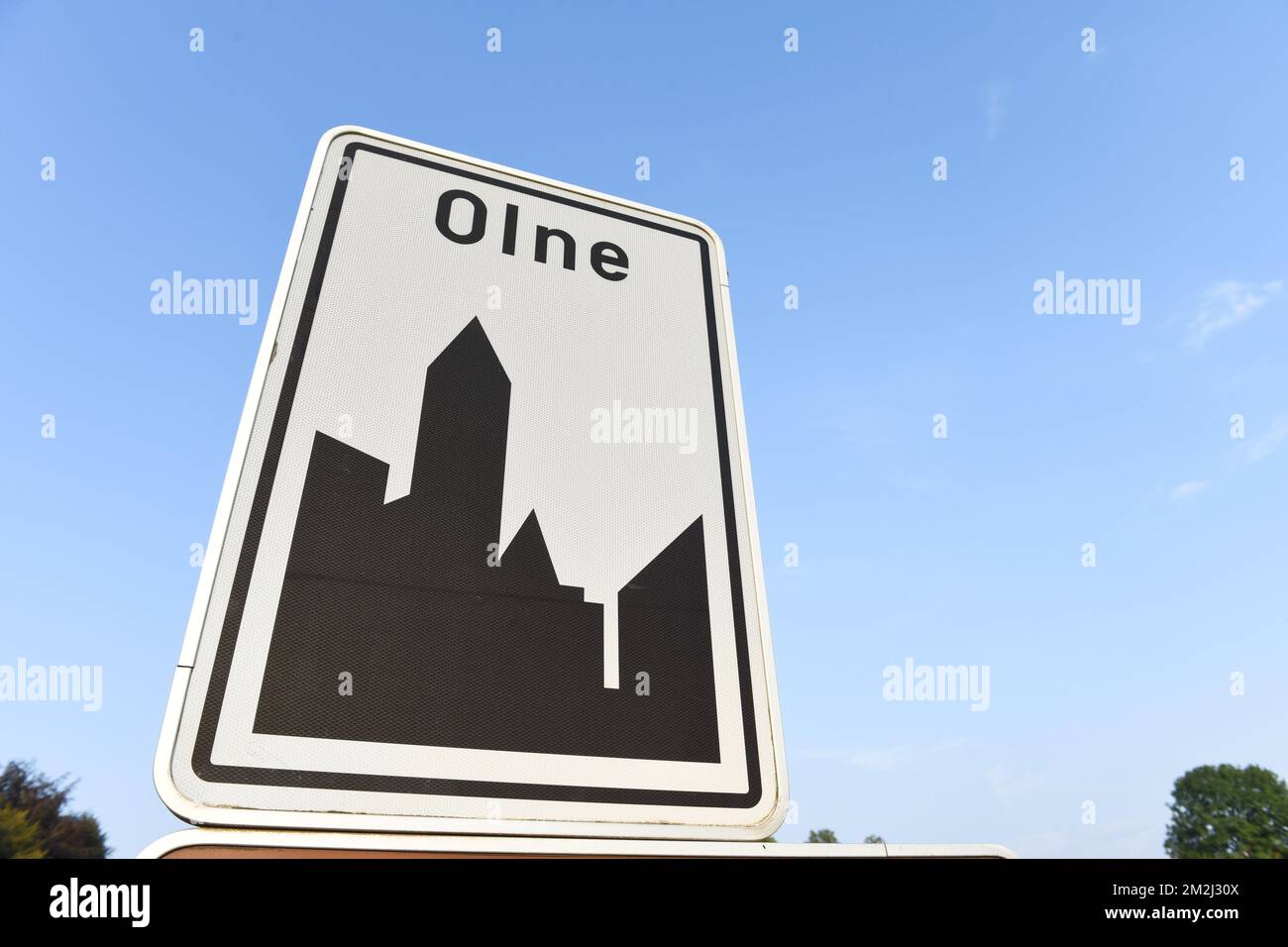 Illustration shows the name of the Olne municipality on a road sign ...