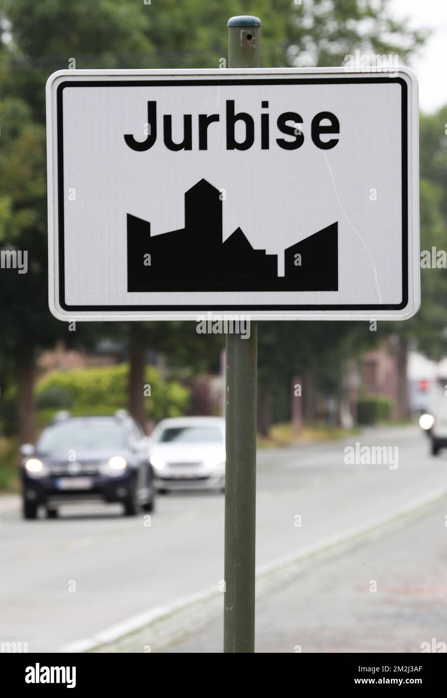 Illustration shows the name of the Jurbise municipality on a road sign ...