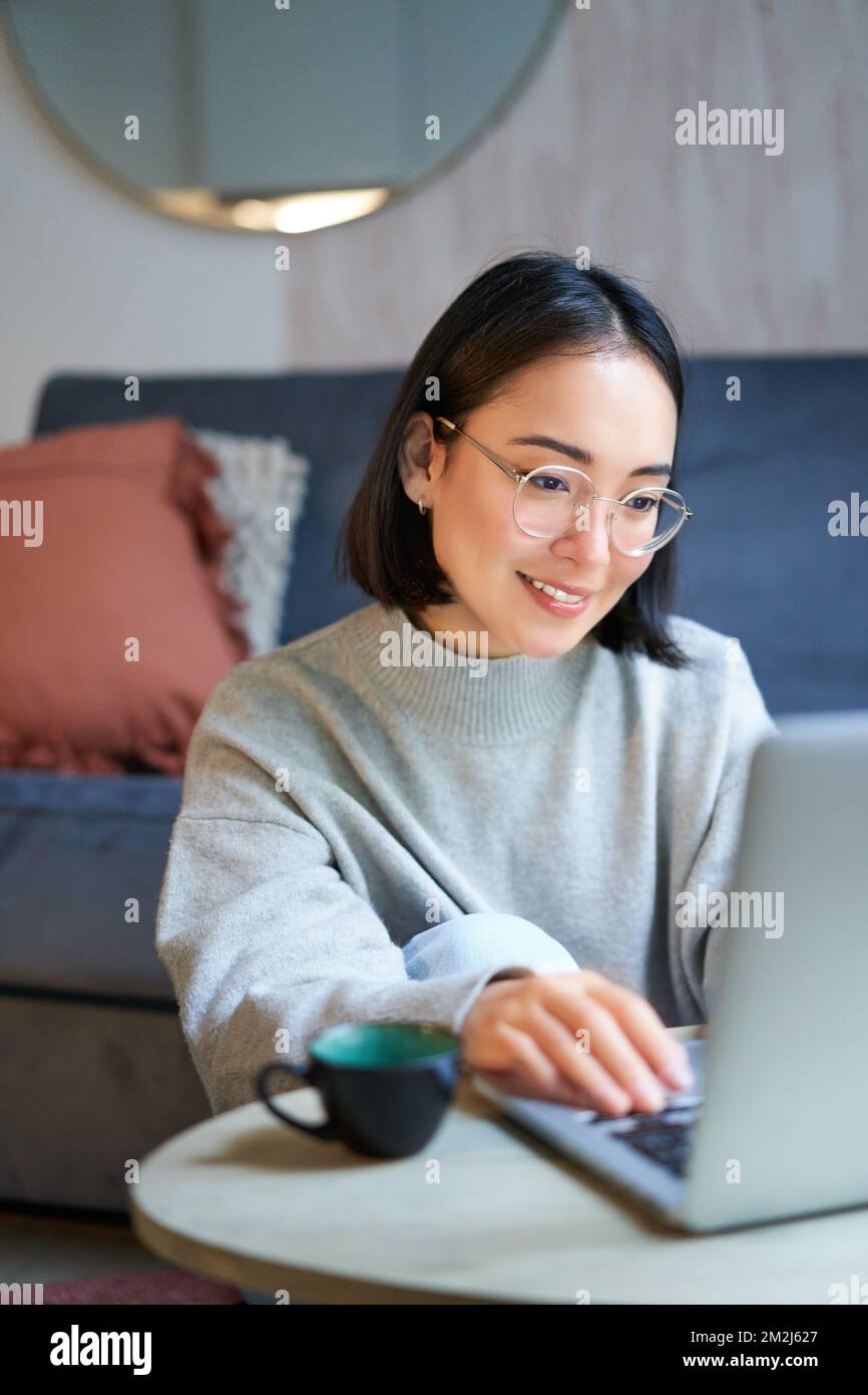 Portrait of working businesswoman using laptop, work on remote. Korean ...