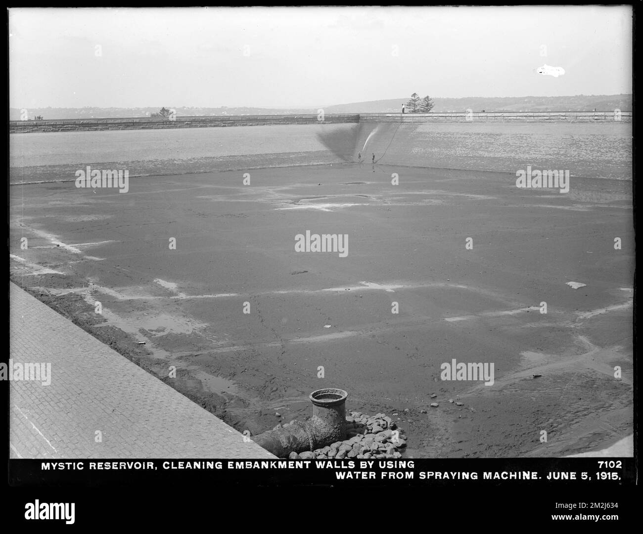Distribution Department, Mystic Reservoir, cleaning embankment walls by ...