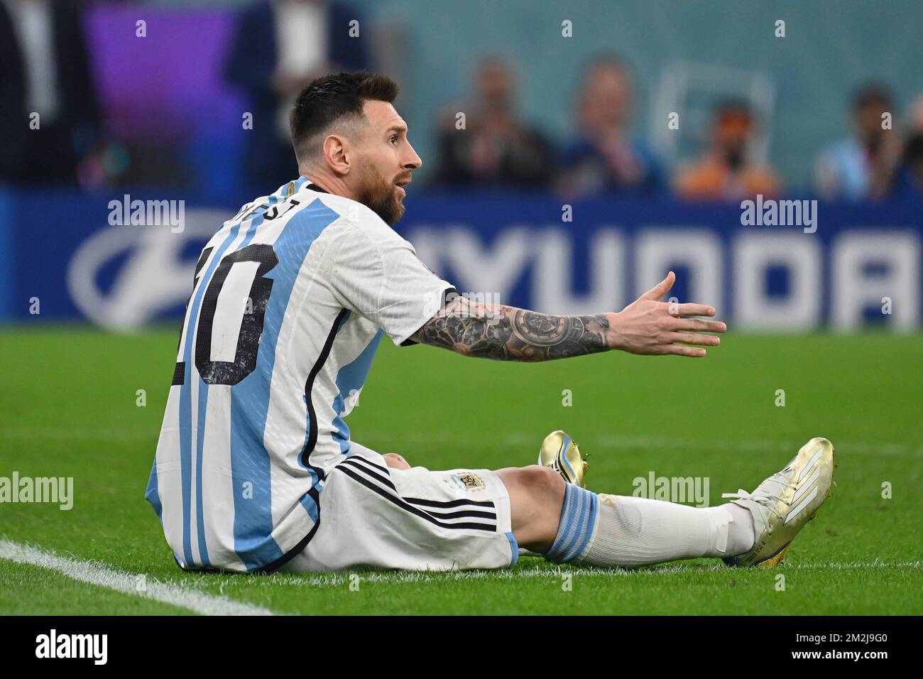 Lionel MESSI (ARG) sits on the pitch, gesture, action, single action ...