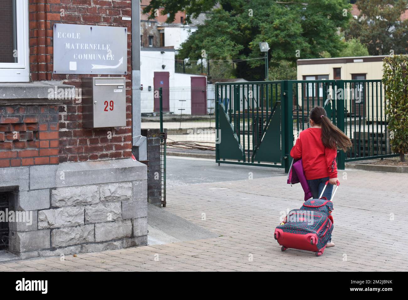 Illustration shows the first day of the new school year at the 'Ecole ...