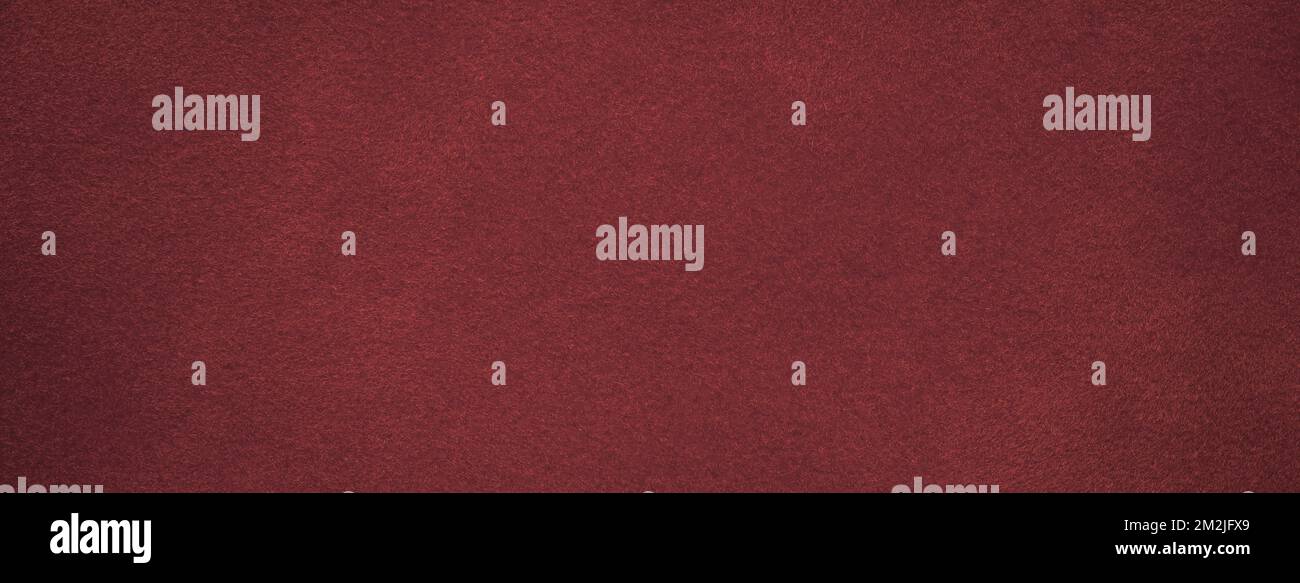 Background of dark red suede fabric closeup. Velvet matt texture of ...