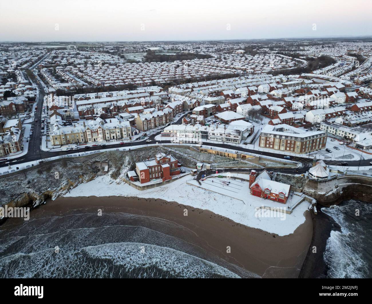 Overnight snow at Cullercoats Bay in North Tyneside. Snow and ice have ...
