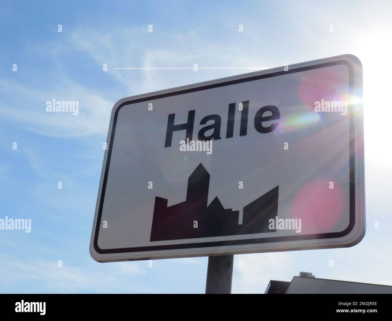 Illustration shows the name of the Halle municipality on a road sign ...