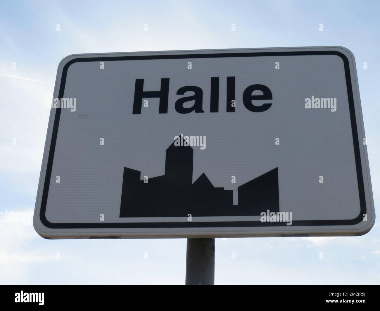 Illustration shows the name of the Halle municipality on a road sign ...