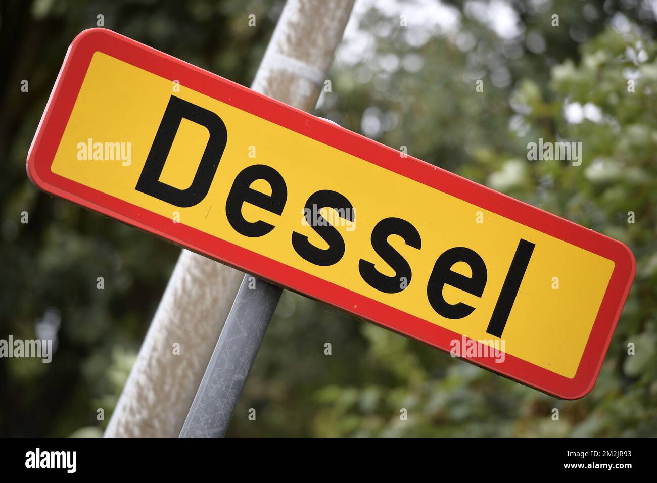 Illustration shows the name of the Dessel municipality on a road sign ...