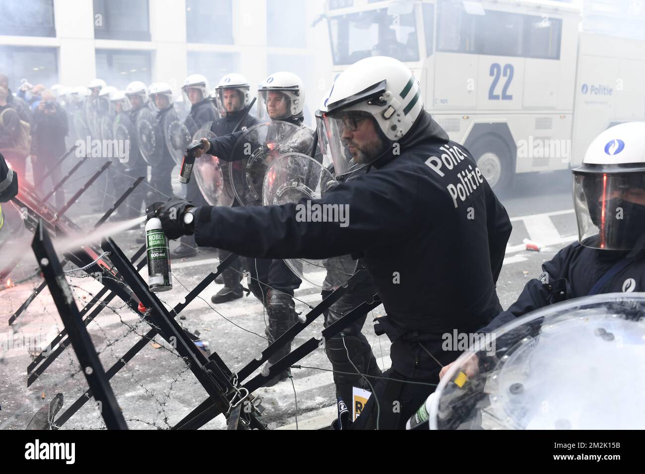 Riot police pictured using pepper spray at a demonstration of the ...