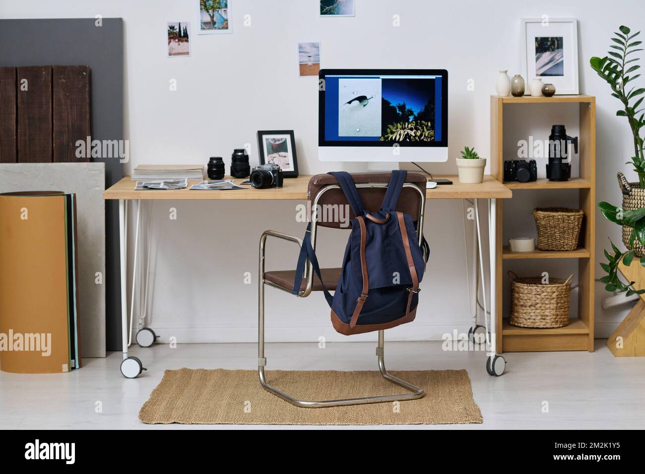 Modern studio with workplace of photographer with computer monitor on ...