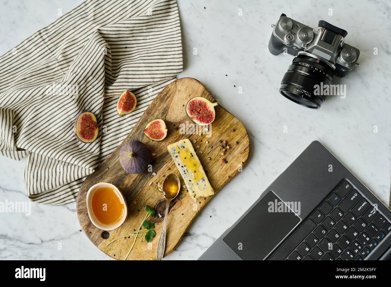 High angle view of still life of wooden tray with exotic fruit and ...