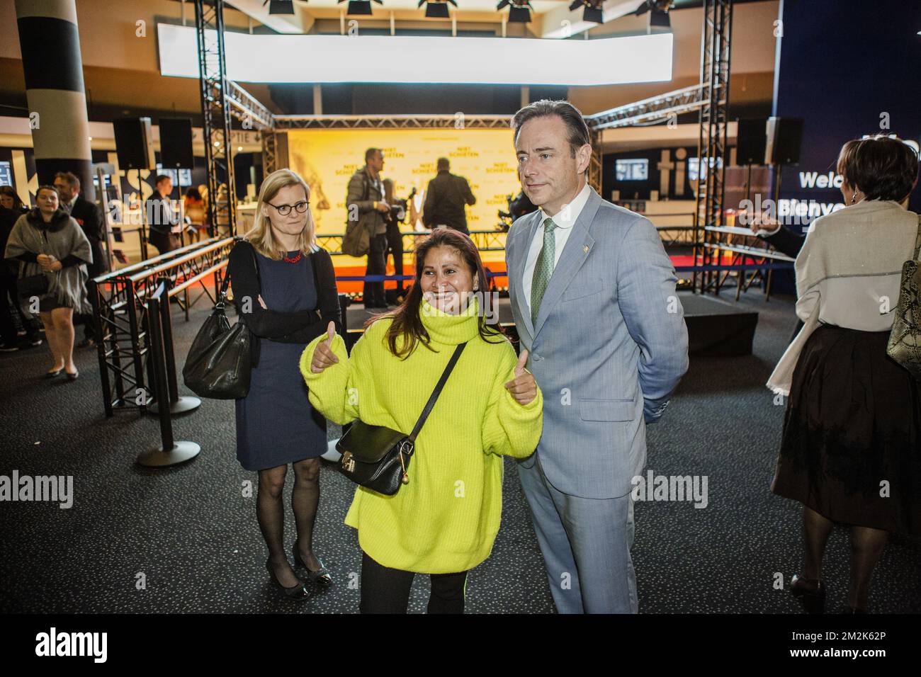 A woman poses for a picture next to N-VA chairman Bart De Wever while ...