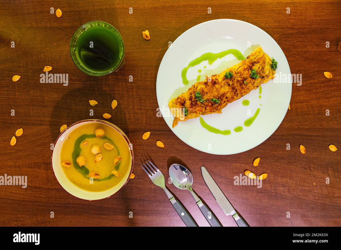 Top down view to kitchen table with few dishes like egg omelette with ...