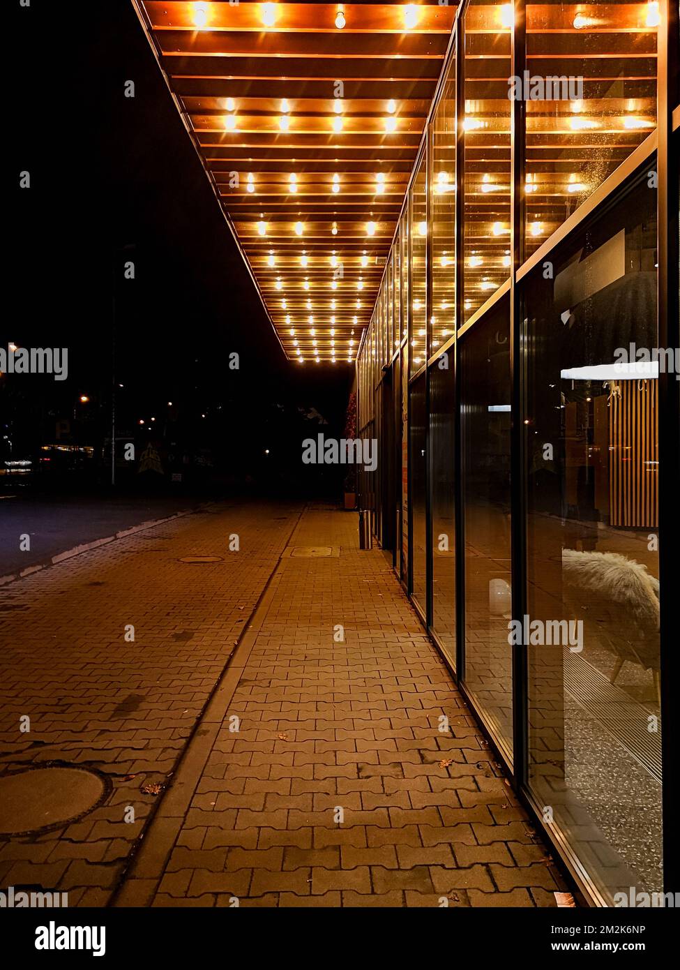Small roof full of small lights at entrance to building Stock Photo - Alamy