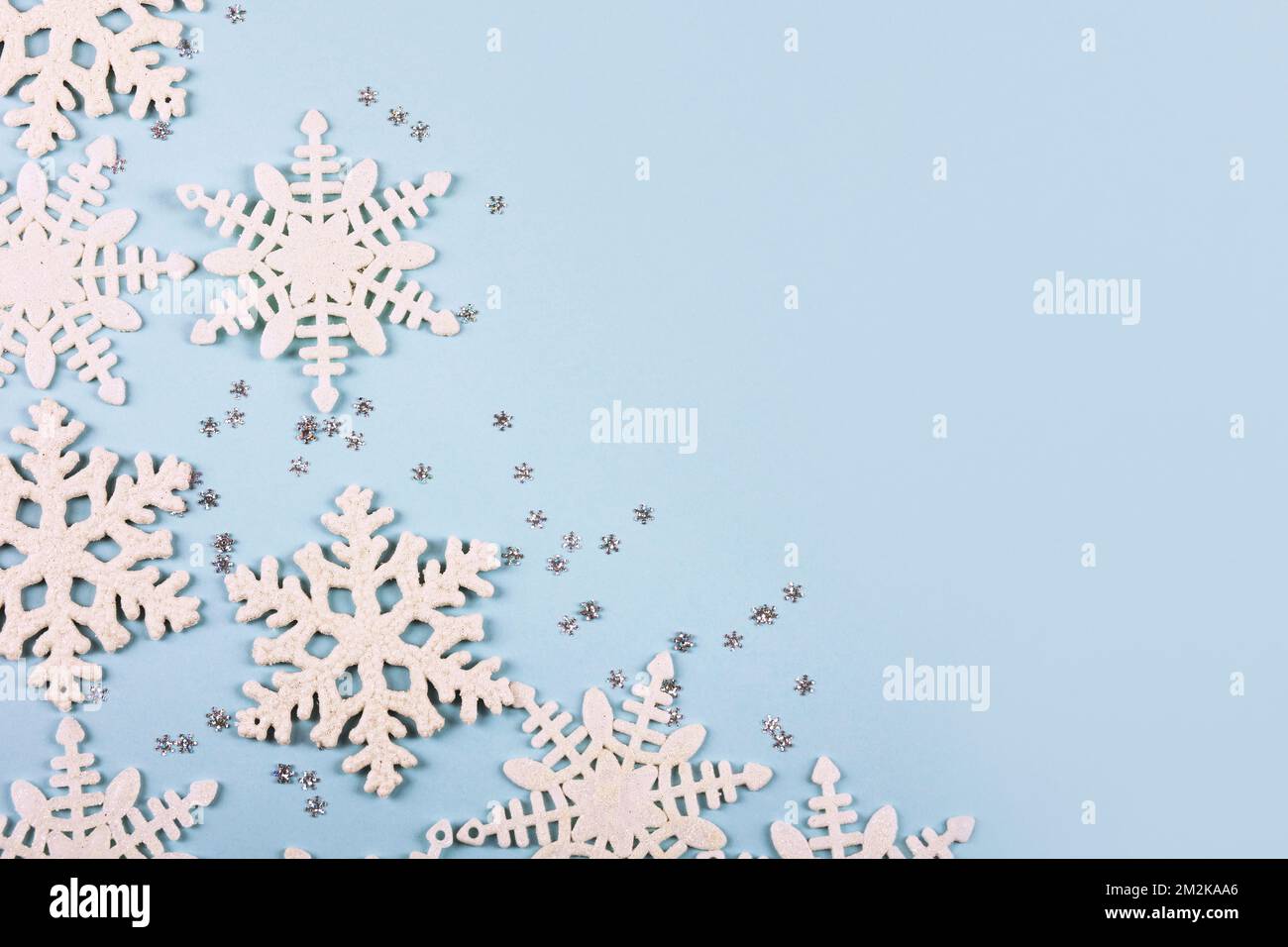 Christmas composition with a place for the text. White snowflakes on a ...
