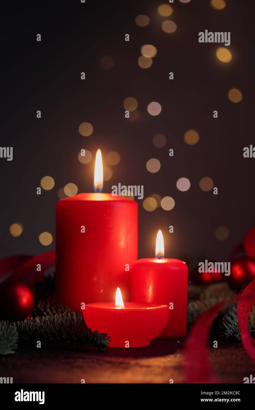 Red candles on dark background with bokeh lights Vertical with ...
