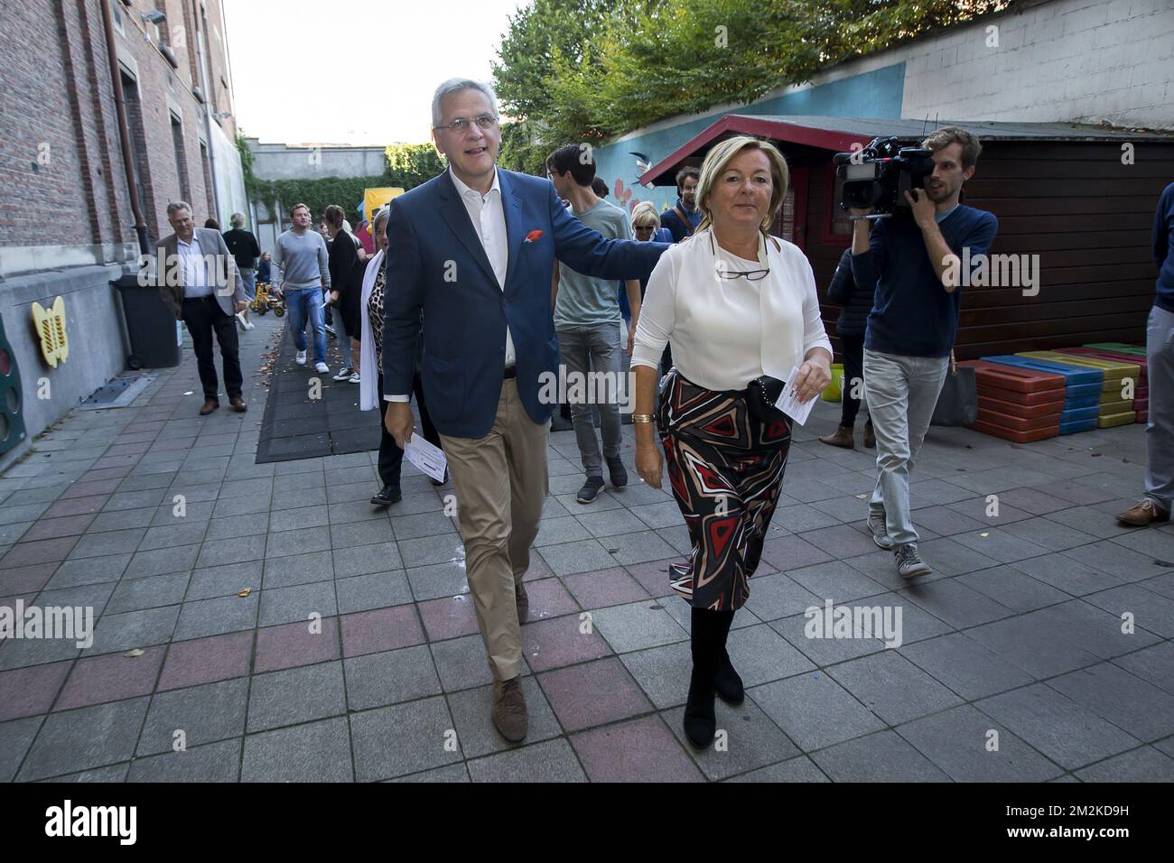 Kris Peeters and his wife Ann cast their vote at a polling station in ...