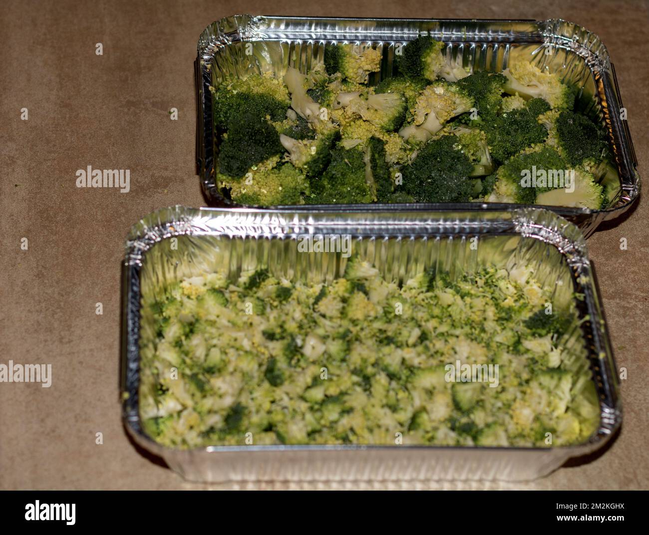photo of broccoli in disposable baking dishes on the table Stock Photo ...