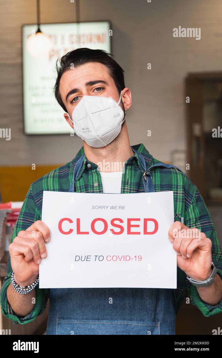 Horizontal banner or header young waiter looking at camera with face ...