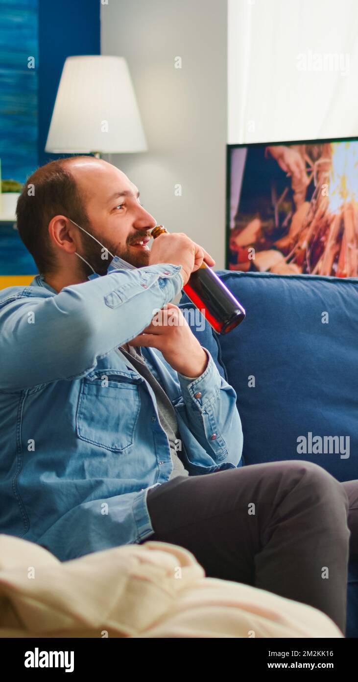 Mixed friends with protection mask, talking during new normal party ...